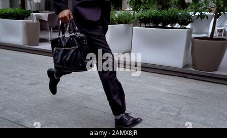 Young employee in time management concept in the office Stock Photo - Alamy