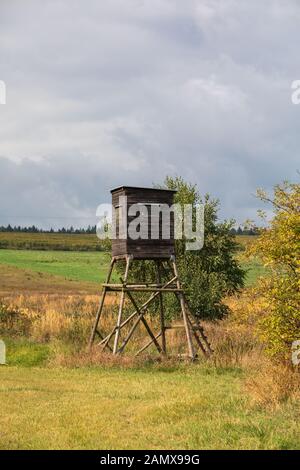 Wooden Hunters hunting tower in countryside landscape, Fall autumn ...