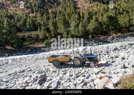 Dump truck in quarry, tipping load of stones Stock Photo - Alamy