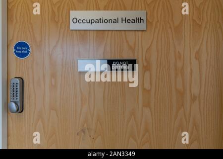 Occupational Health sign on a door at a workplace Stock Photo - Alamy