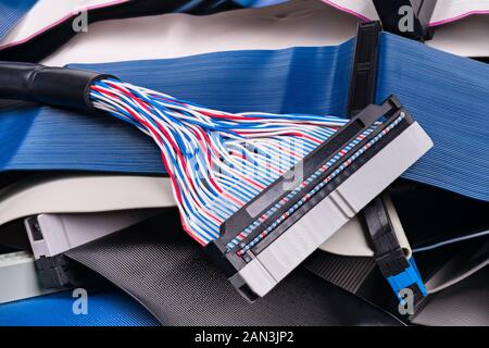Flat multi wire ribbon cables pile. Internal parallel bus connectors ...