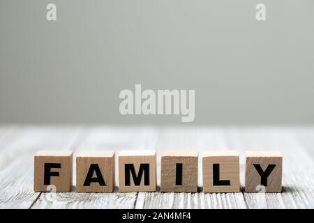 family word written on wood block. family text on table, concept Stock ...