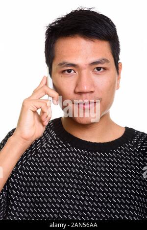 Asian Man Holding Smartphone With White Empty Screen On Yellow ...