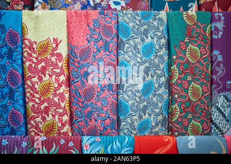 A display of colorful, traditional Malay floral design fabric, textiles ...