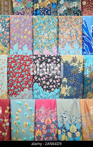 A display of colorful, traditional Malay floral design fabric, textiles ...