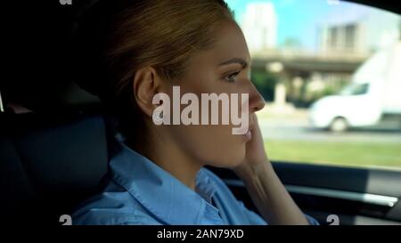 Woman feeling stressed and tired while driving or stuck in traffic ...
