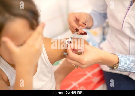 vaccination of children. An injection. Selective focus kids Stock Photo ...