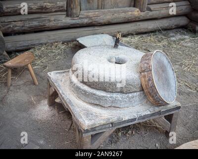 Rotary discoid mill stone for hand-grinding a grain into flour ...