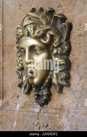 The head of Medusa Gorgon in the form of a bas-relief of the fountain ...