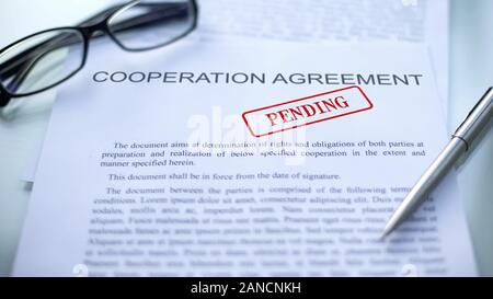 Investment agreement pending, seal stamped on official document ...