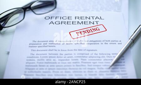 Loan agreement pending, officials hand stamping seal on business ...