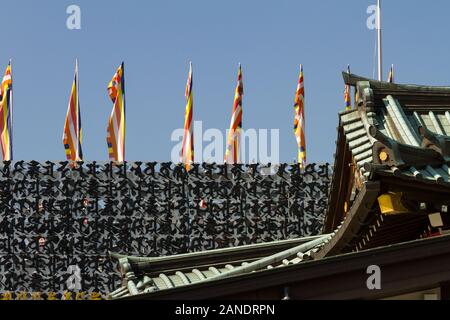 Detail image of the Roof of Fudoson Temple in in front of black and ...