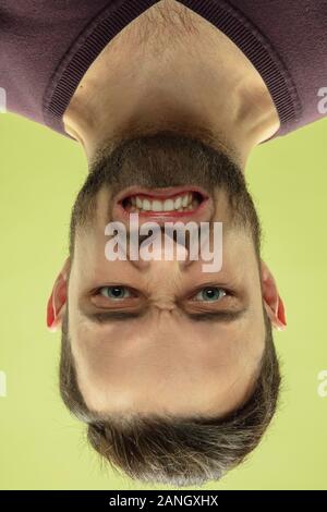 Half-length portrait of young scary girl isolated on red studio ...