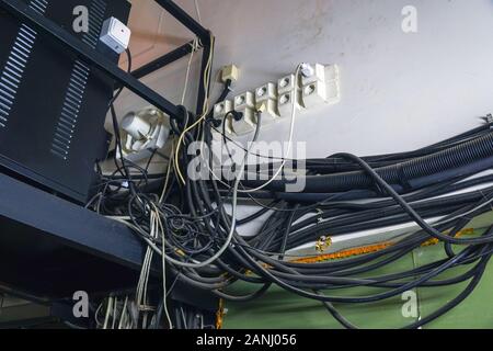 Electrical cables hanging on a wall backstage in a theater Stock Photo ...