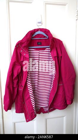 Pink Marks and Spencers Rain Mac Stock Photo - Alamy