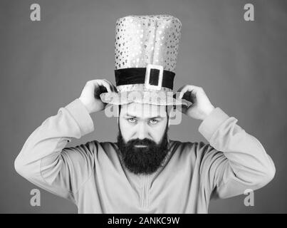 The raising of the green. Happy irish man with beard keeping arms ...