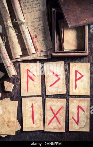 Unique runic divination by cards with futhark alphabet on wooden table ...
