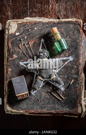 Scary voodoo doll burned with a needle and fire as a Halloween ...
