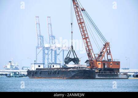 Sand tanker at the sand loading station with loader Stock Photo - Alamy