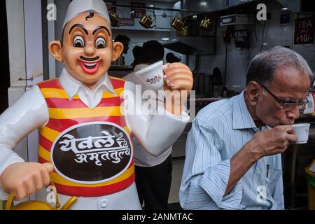 A man having a cup of tea at a branch of the Yewale Amruttulya chain of ...