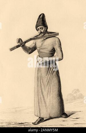 Torment. Prisoner in Persia. Ancient Persian yoke. Iran. Old steel ...