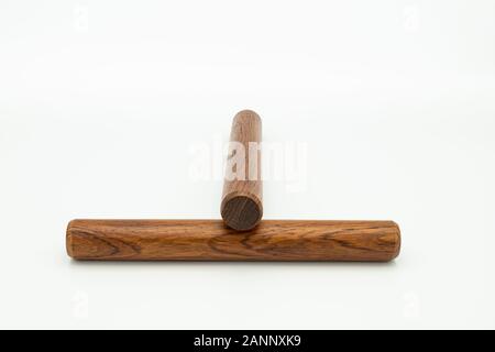Wooden claves isolated on a white background Stock Photo - Alamy