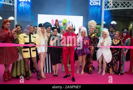 RuPaul, surrounded by famous drag Queens, cuts the ribbon to open ...