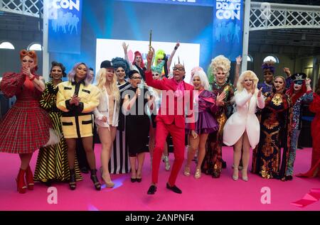 RuPaul, surrounded by famous drag Queens, cuts the ribbon to open ...