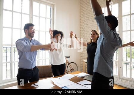Satisfied happy excited diverse people jumping, have fun and show ...