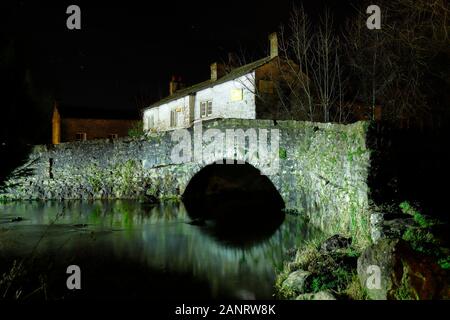 A road bridge that crosses over Malham Beck to connect the East & West ...