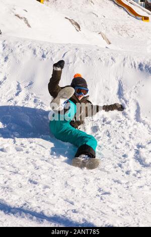 Ten year old boy with a toboggan at the top of Semmering ski resort ...