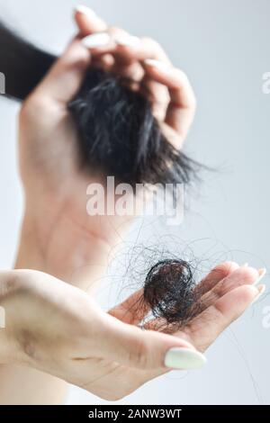 Hair fall problem, closeup hand holding comb and problem hair ...