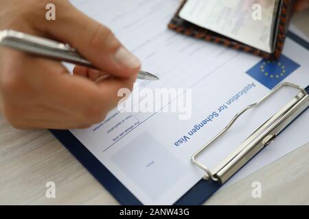 Man writing down personal information Stock Photo - Alamy