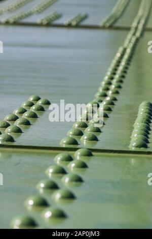 Metal parts of the rivet joints and bolts of the bridge construction ...