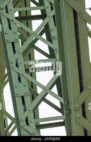 Metal parts of the rivet joints and bolts of the bridge construction ...