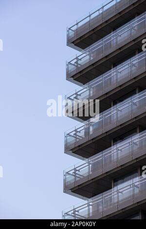 A closeup shot of a residential building with balconies on a sunny day ...