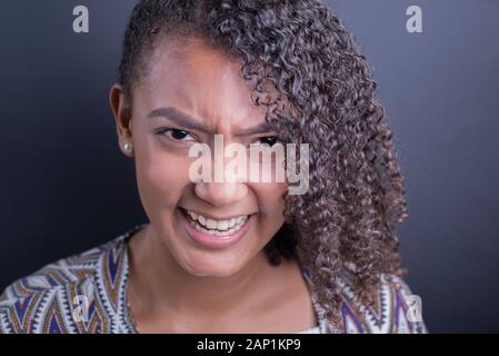 Screaming, hate, rage. Crying emotional angry woman screaming on blue ...