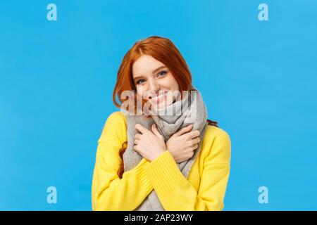 Winter and holidays concept. Cute redhead teen girl in beania, gloves ...