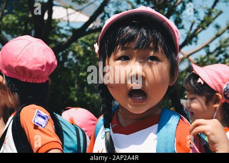 Kids lining up to go to school Stock Photo - Alamy
