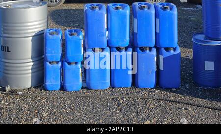 The blue plastic barrels for storage of chemicals . Stockpile of used ...