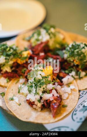 Carne asada and al pastor street tacos Stock Photo - Alamy