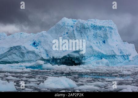 Blue ice of a glacier, Antarctica. Blue ice contains fewer air bubbles ...