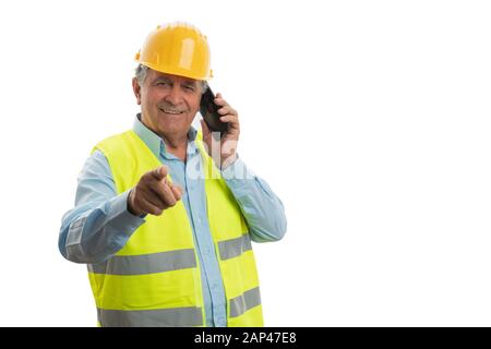 Old builder man with friendly expression offering handshake as greeting ...