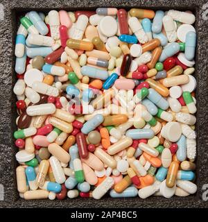 Medicine background with lots of colorful medicines drugs and tablets ...