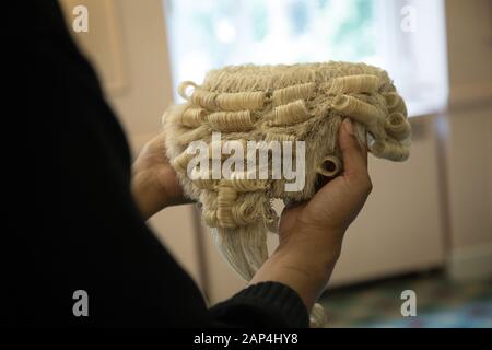 A wig being held, as worn by some judges and barristers in England and ...