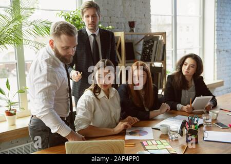 The team to get it done. a group of happy coworkers in a meeting Stock ...