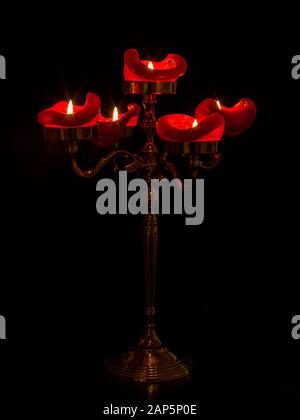 Candelabra with five shining candles on a table in the dark Stock Photo ...