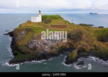 Aerial view of Fidra Island and lighthouse on Firth of Forth in East ...