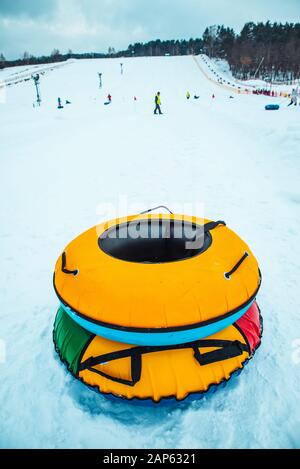 snow tubing rings close up. hill on background Stock Photo - Alamy
