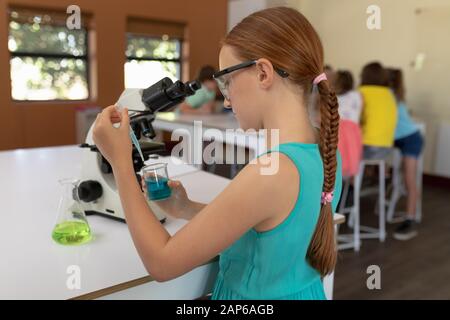 School boy in chemistry class Stock Photo - Alamy